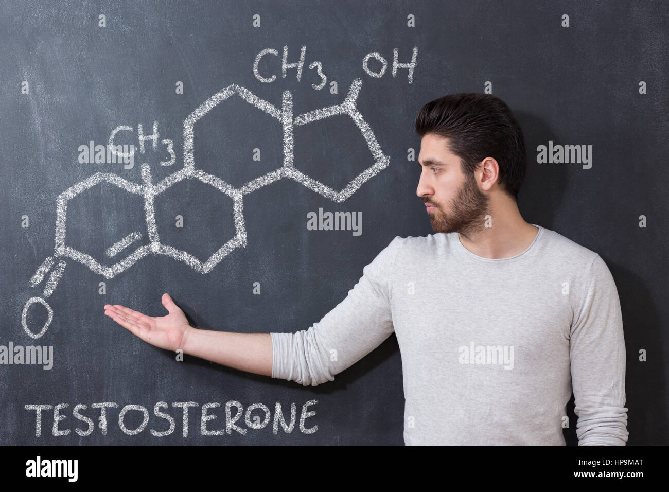 chemical structure of testosterone molecule drawn on chalkboard ...