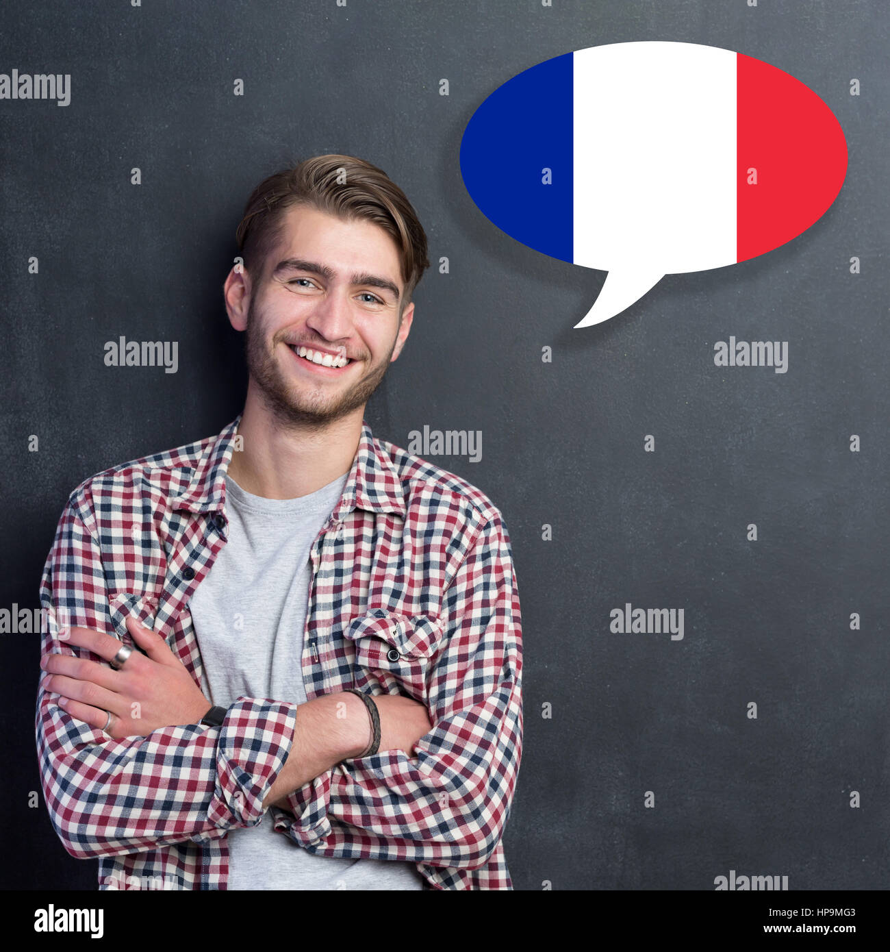 Man learn speaking french in bubble on chalkboard Stock Photo - Alamy