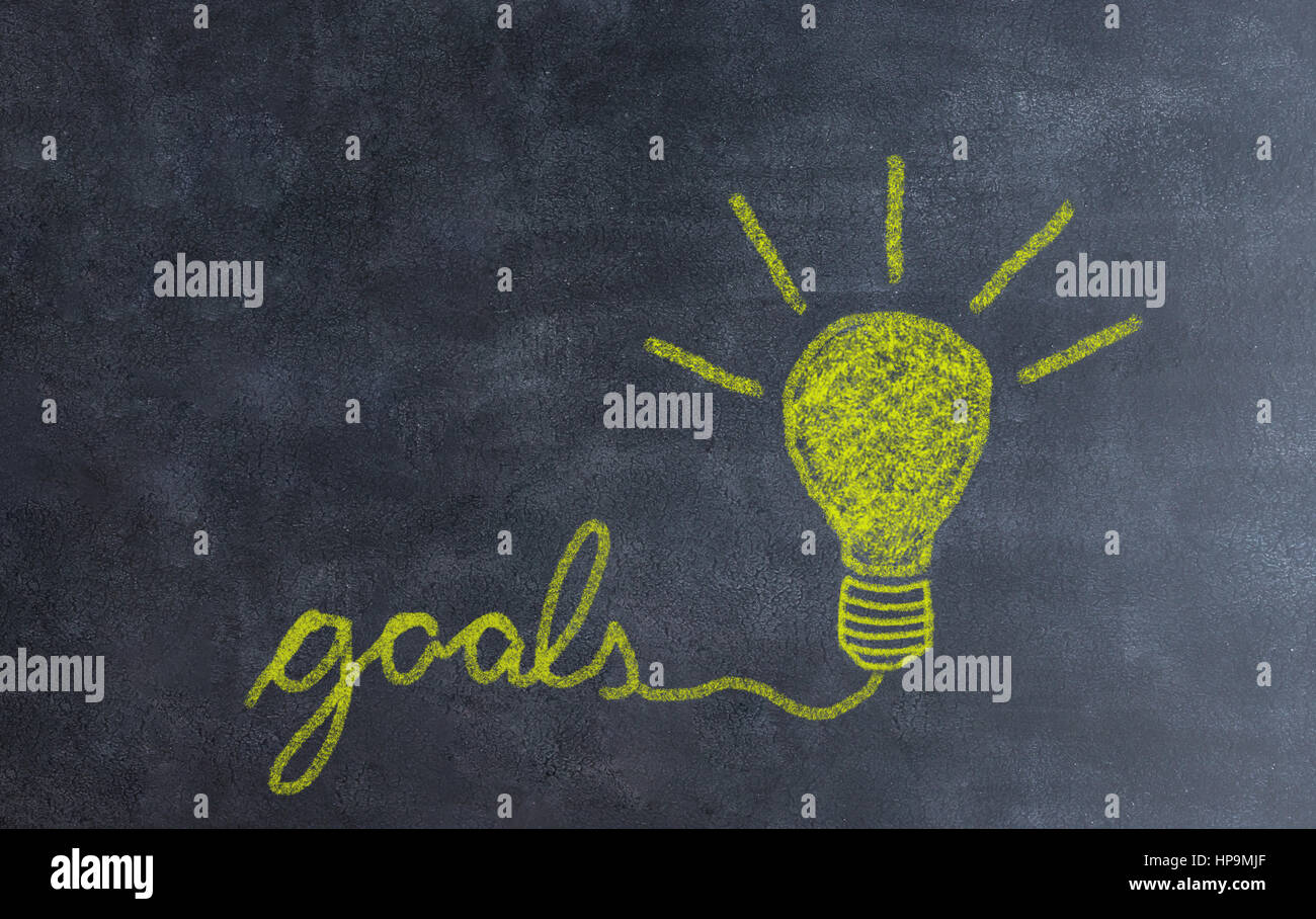 idea bulb on chalkboard background. goals concept Stock Photo - Alamy