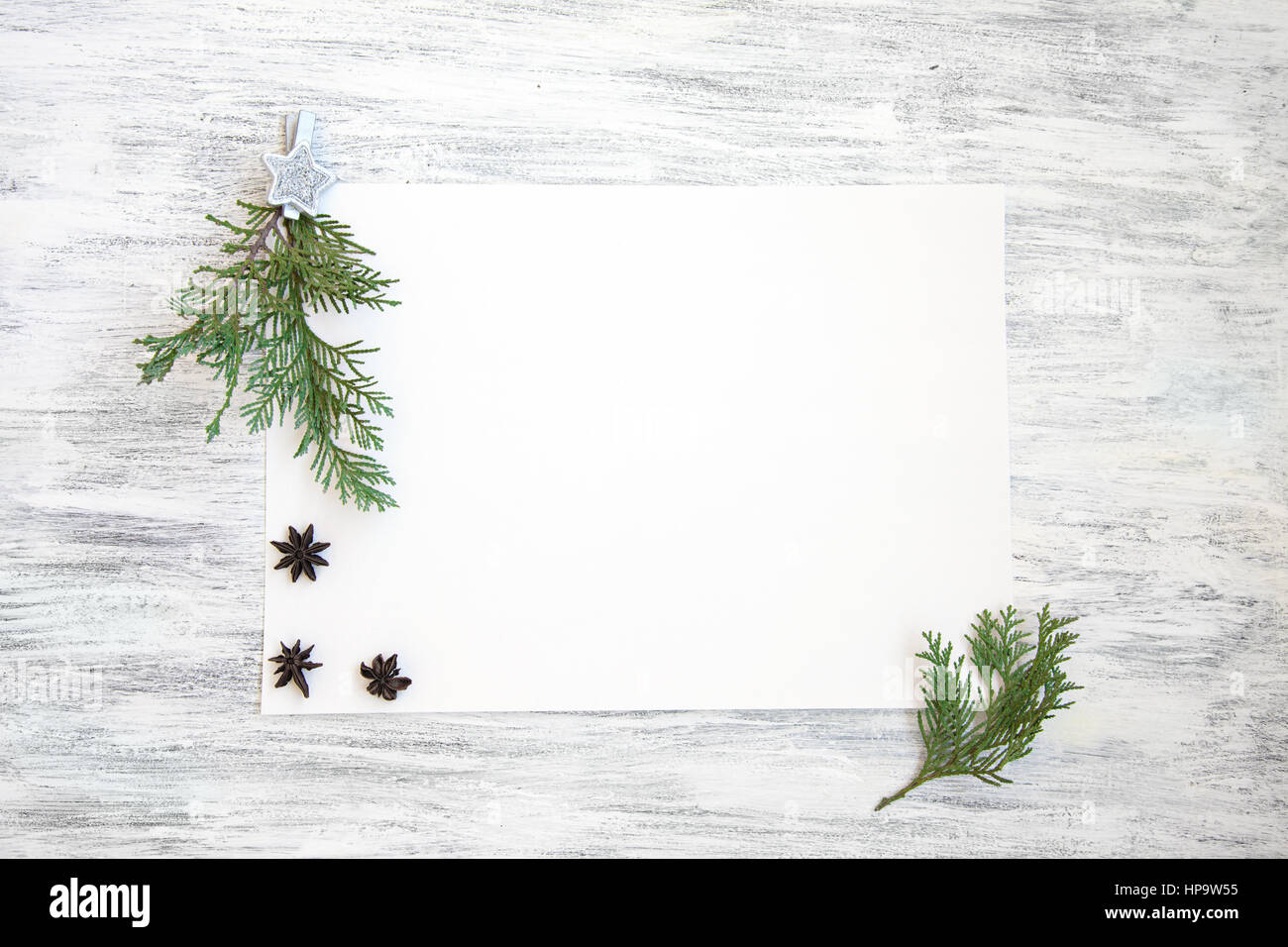 Winter flat lay template background with blank sheet and pine branches ...