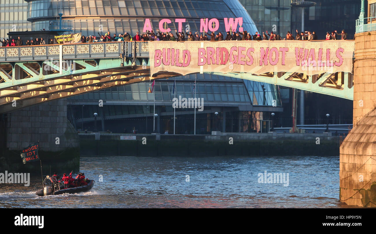 A protest against the presidency of Donald Trump is conducted by ...