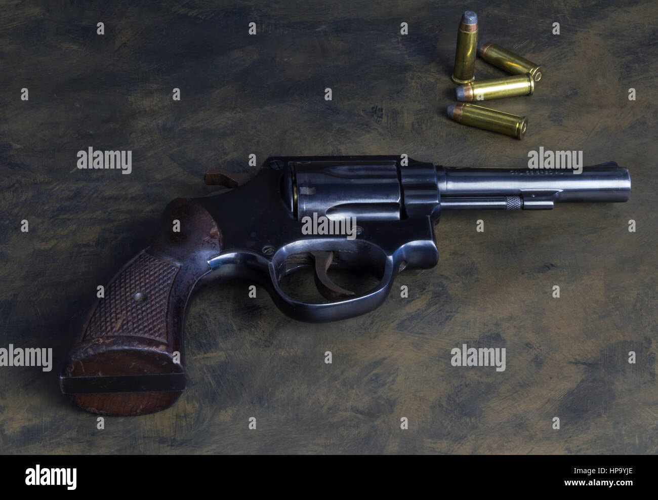Six shooter loaded gun, .38 caliber handgun with wood grip and brass ...