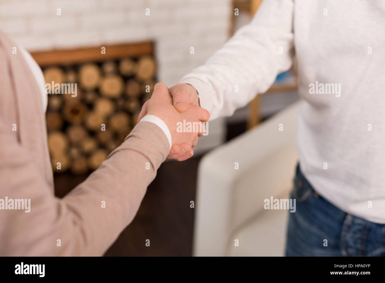 Gretting each other. Close up of a handshake of two people while ...