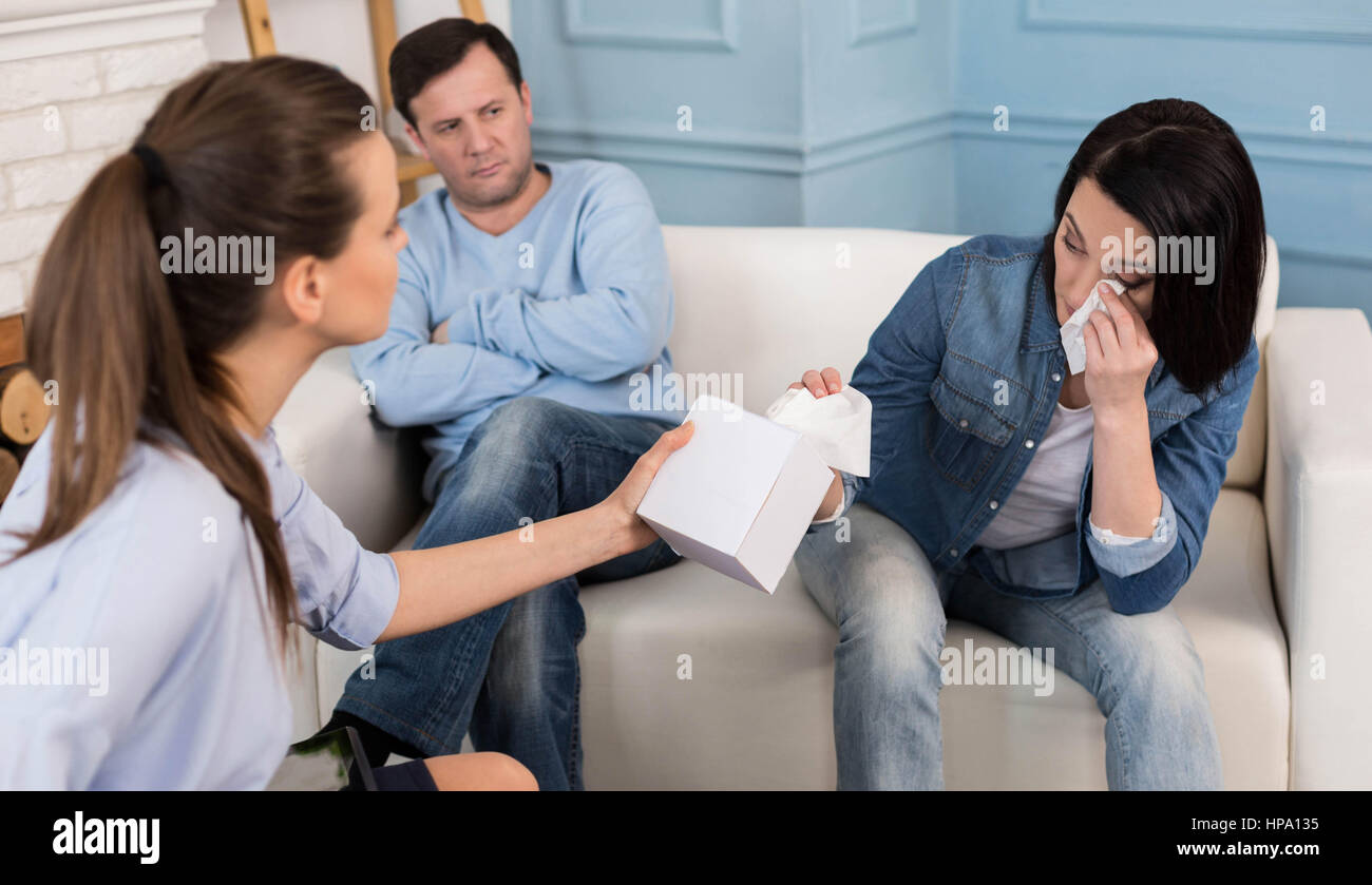 Thank you. Nice depressed upset woman taking a paper tissue out of the ...