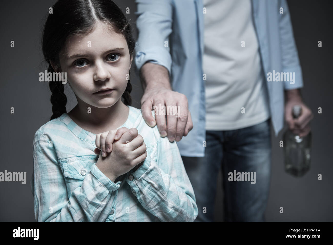 Ask you for help. Little girl keeping her eyes widely opened while ...