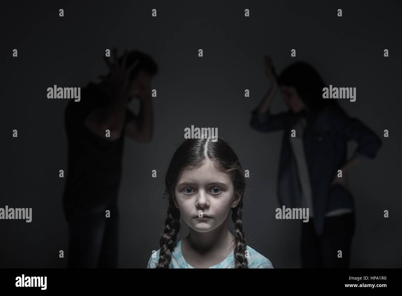 Help me please. Thoughtful female child wearing blue shirt standing on ...