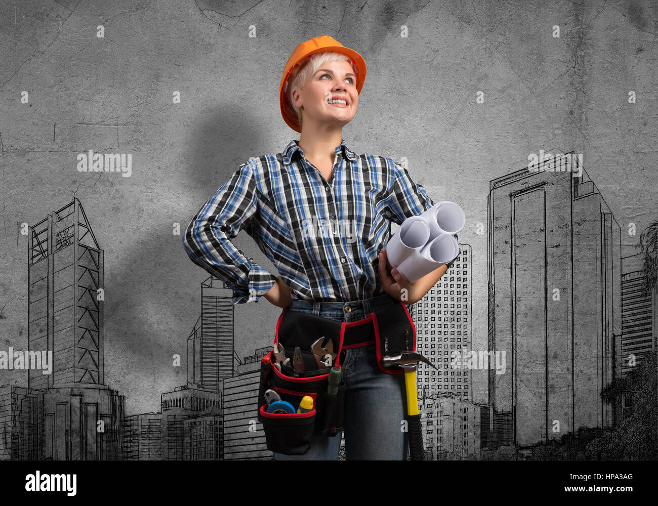 Engineer woman with blueprints and sketches of construction project on ...