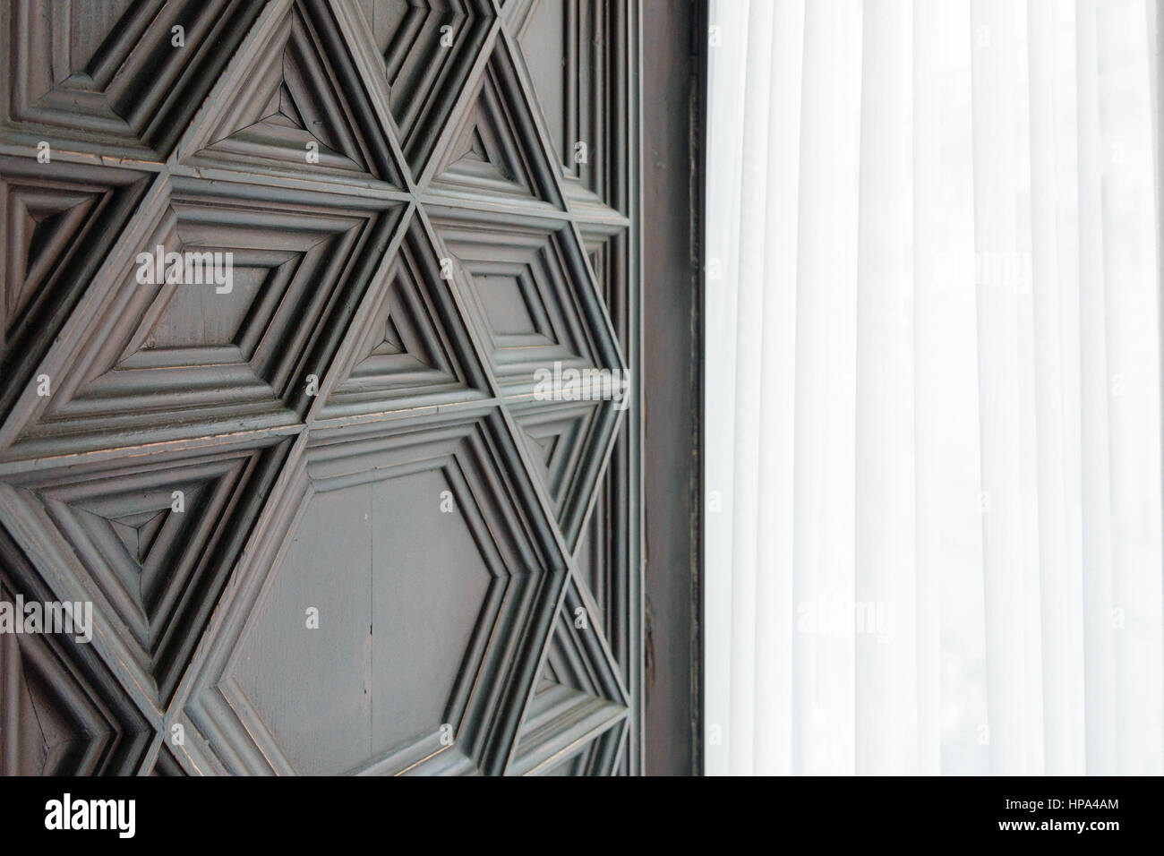 Decorated black wooden window frame Stock Photo - Alamy