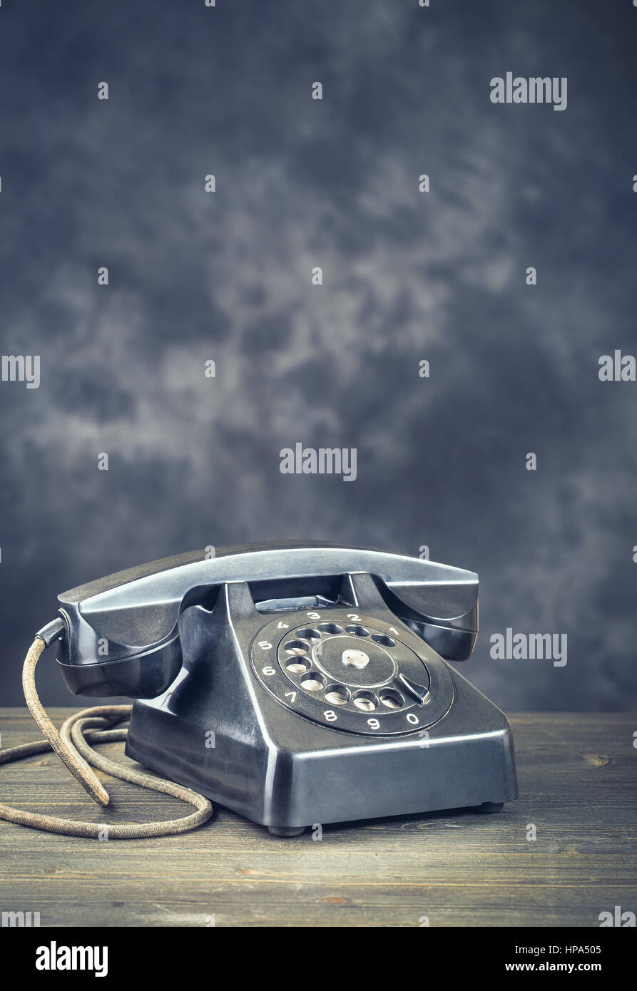 Old black phone vertical Stock Photo - Alamy