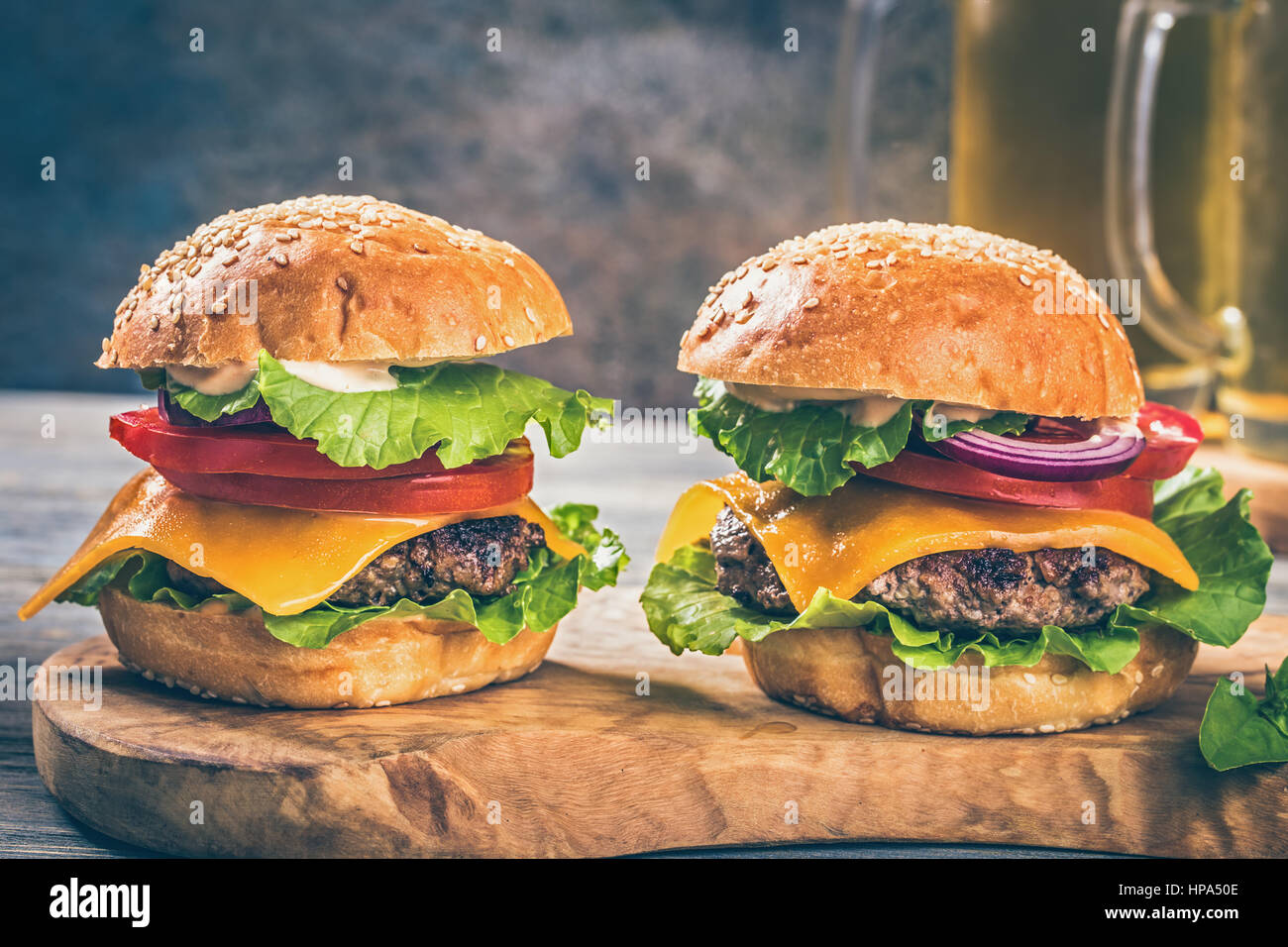 Two hamburgers on board Stock Photo - Alamy