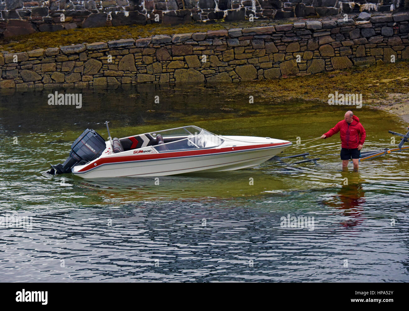 Boat owner launching speedboat. Kyle of Lochalsh, Ross and Cromarty ...