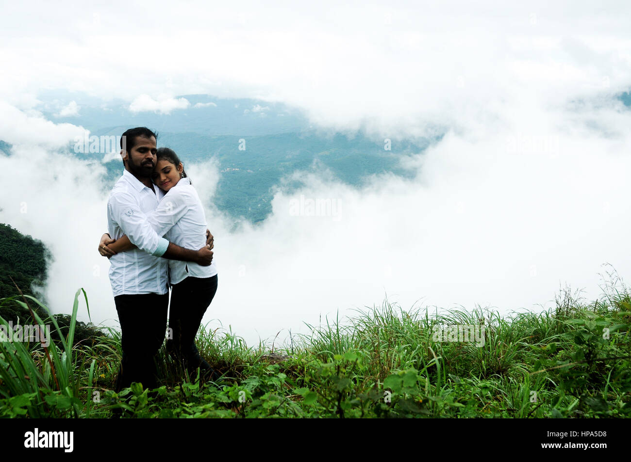 Hugging couple in high mountains, couple hugging in beautiful mountains ...