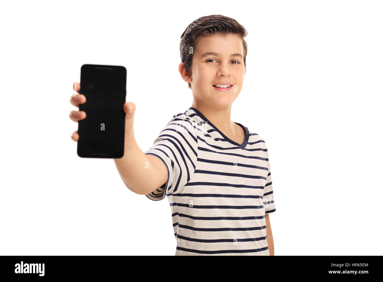 Boy showing a phone isolated on white background Stock Photo - Alamy