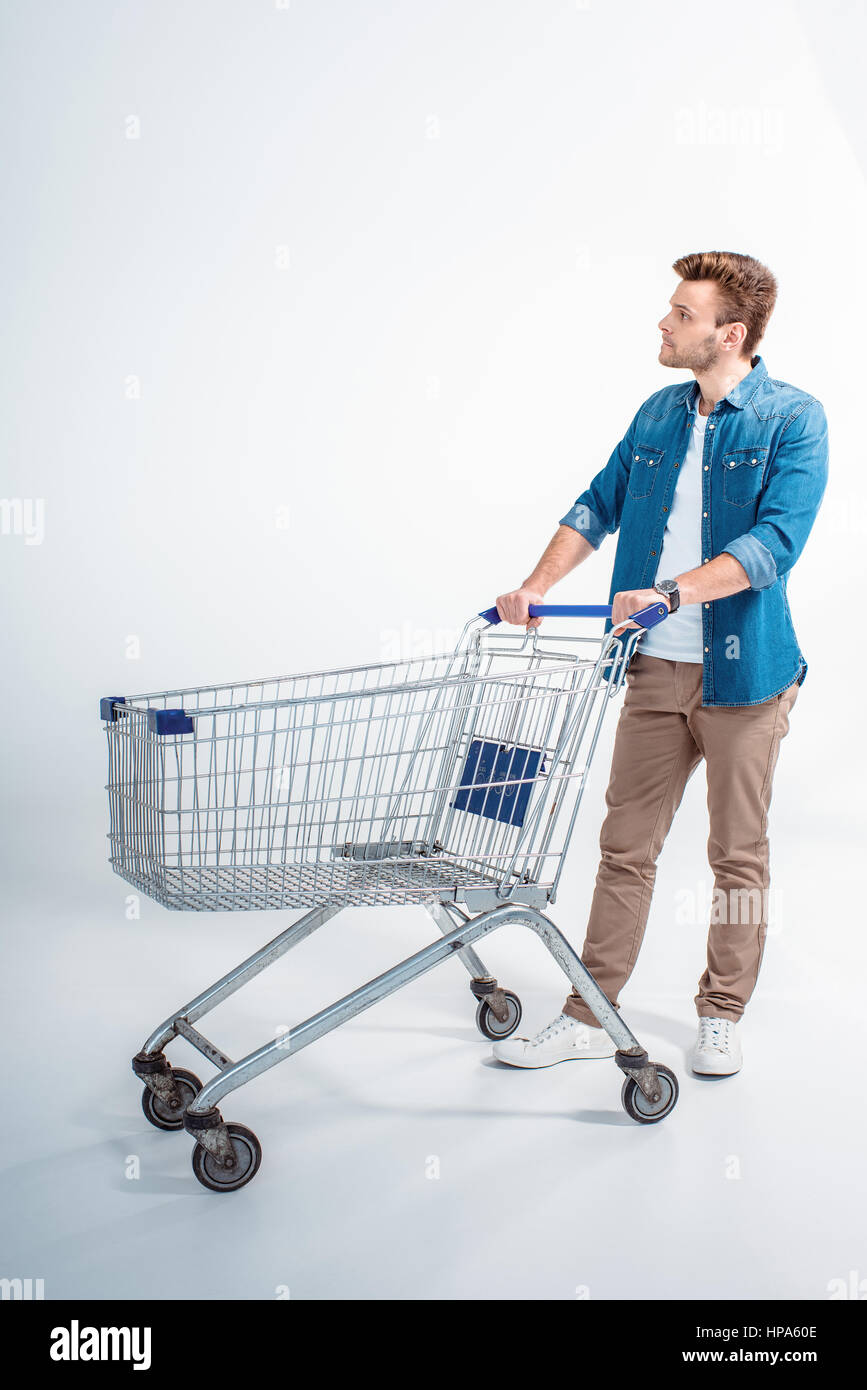 Man with shopping trolley hi-res stock photography and images - Alamy