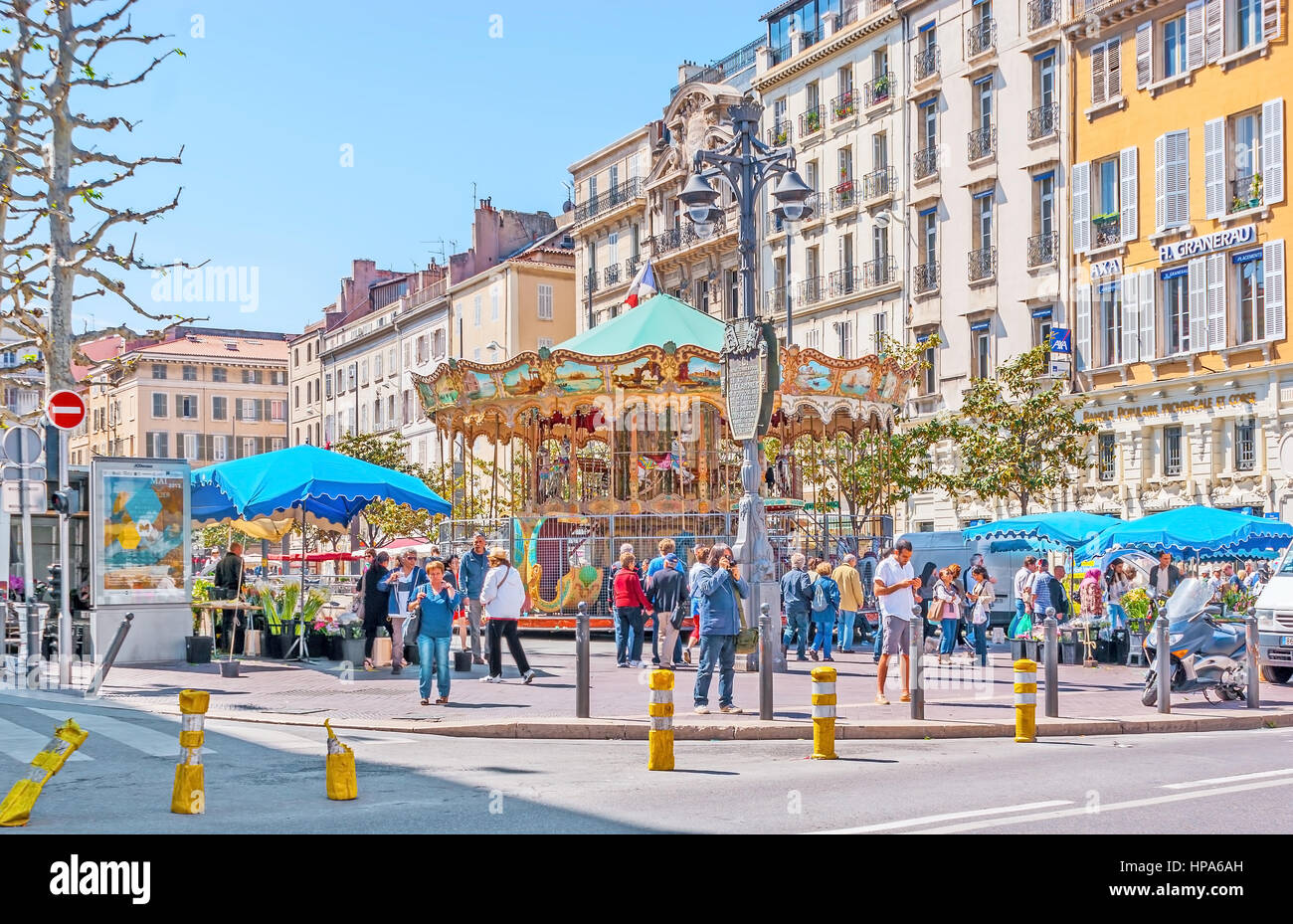 MARSEILLE, FRANCE - MAY 4, 2013: The old fashioned carousel surrounded ...