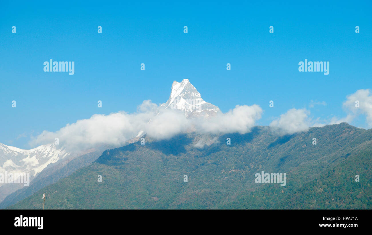 Machapuchare Mountain with cloud formation. A view from Ghandruk, Kaski ...