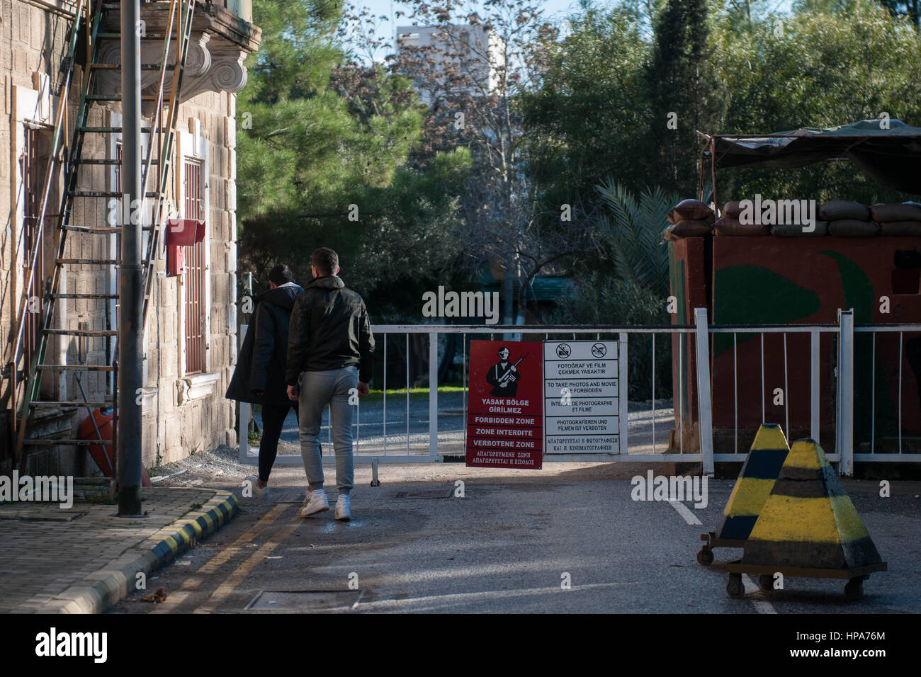 Two boys cross the border that divide the city of Nicosia, Cyprus ...