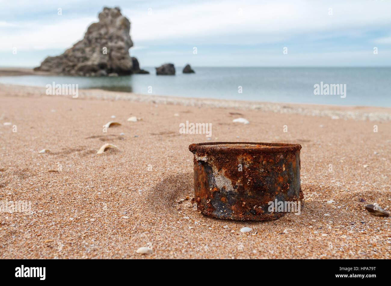 Rusty tin can on the beach Stock Photo - Alamy