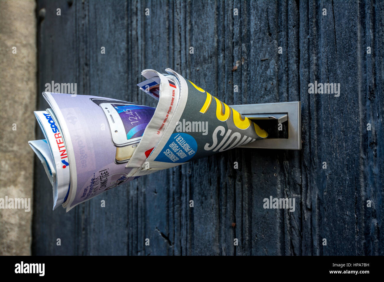 Advertising newspaper in the mailbox Stock Photo - Alamy