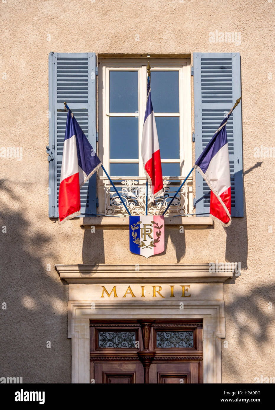 French flags at a city hall frontage Stock Photo - Alamy