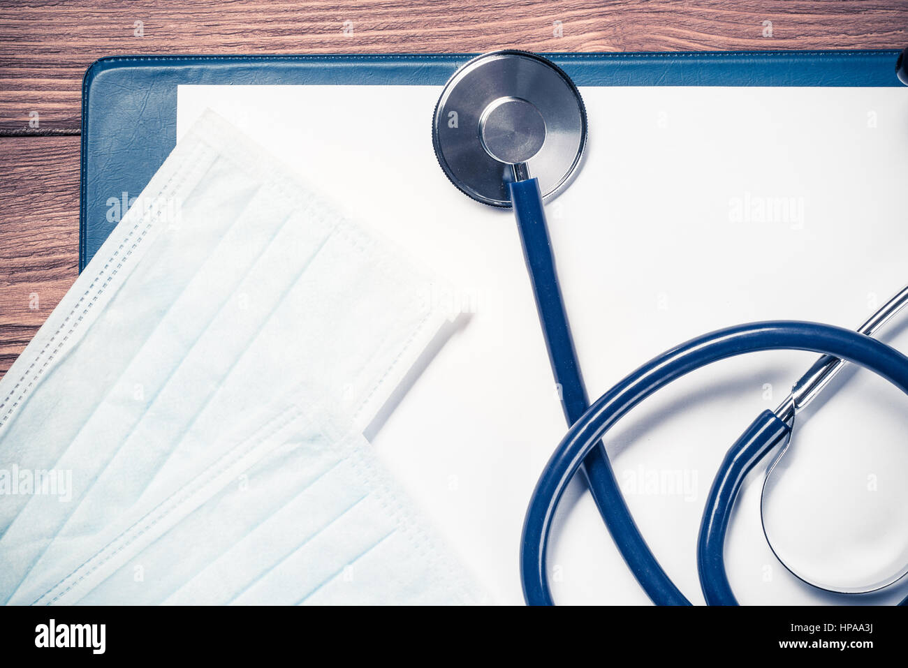 Doctors wooden table with tablet stethoscope and other stuff Stock ...