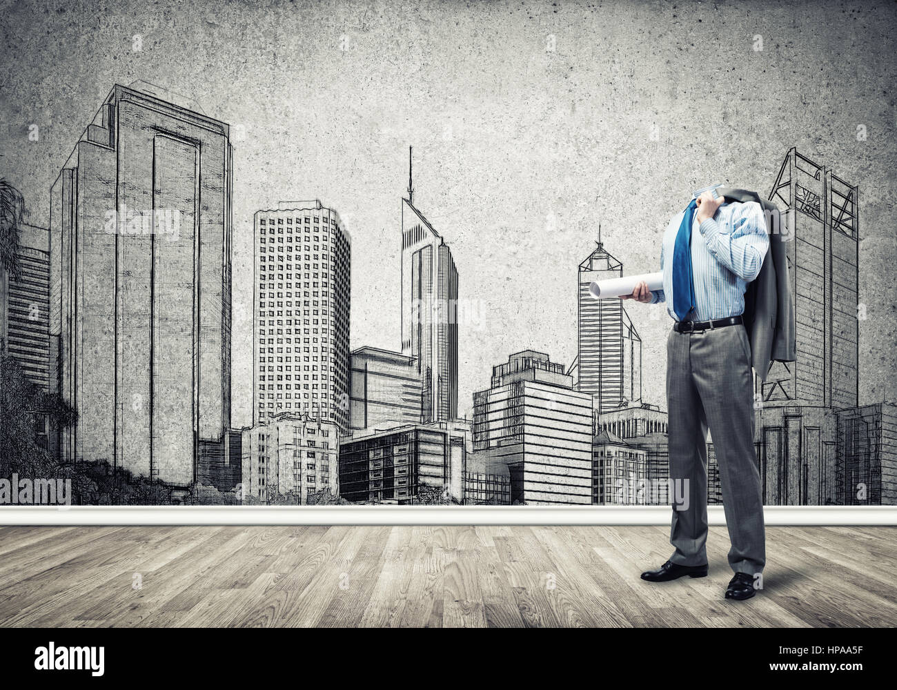 Headless engineer man with papers in hand against construction ...