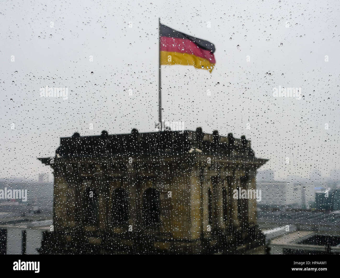 German flag reichstag rain hi-res stock photography and images - Alamy