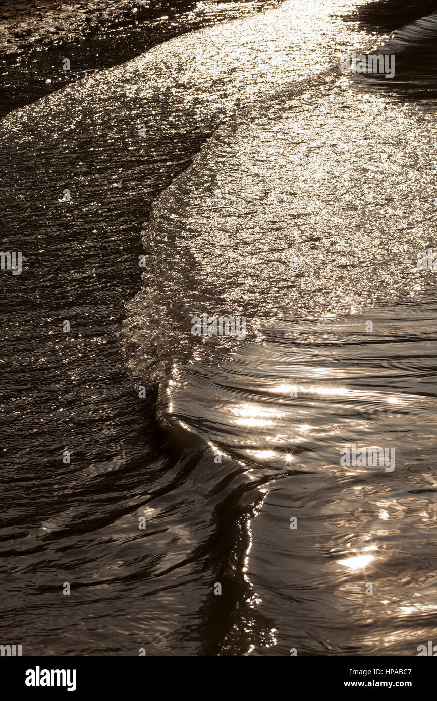 Sunlight reflecting the surface of the sea Stock Photo - Alamy