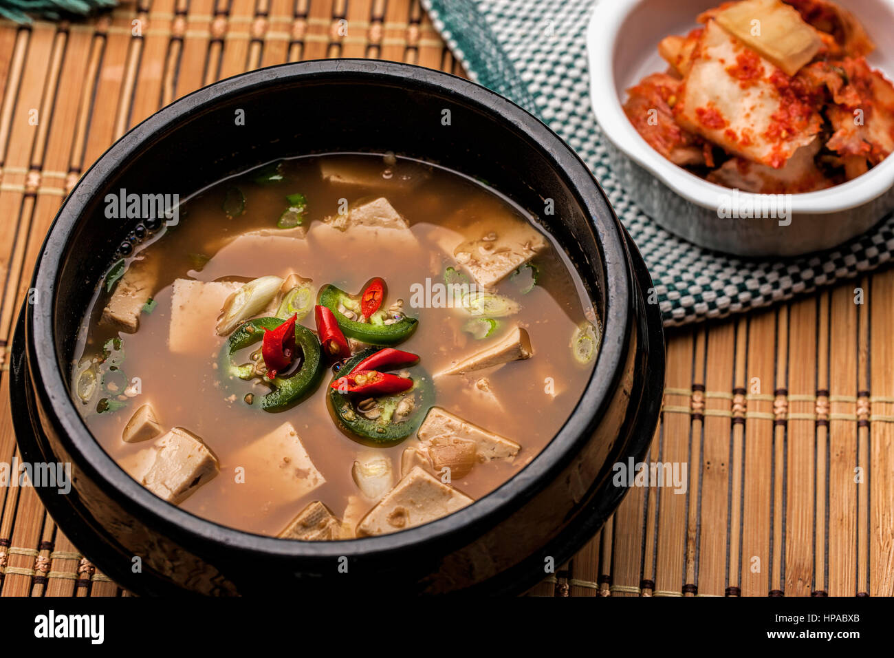 A close up of a popular Korean dish called Denjang Chigae with a side ...