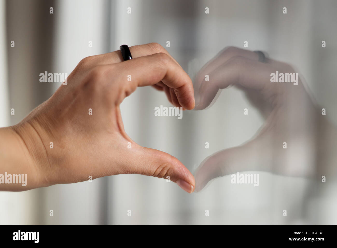 Hand shaping heart Stock Photo - Alamy