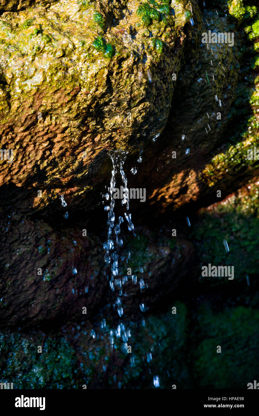 Water falling down rock face hi-res stock photography and images - Alamy