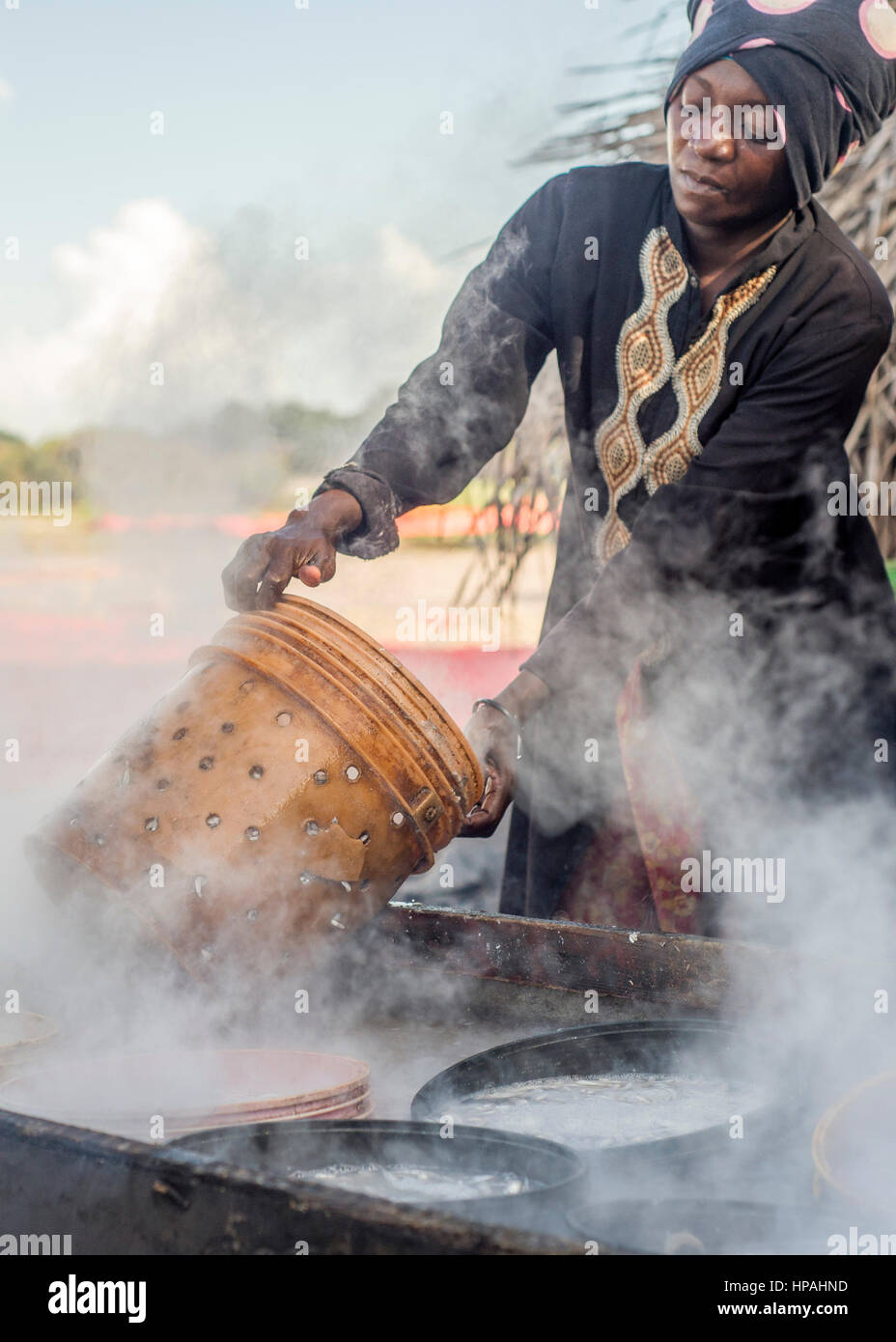 People prepare anchovies, locally called Dagaa, for drying at Mkokotoni ...