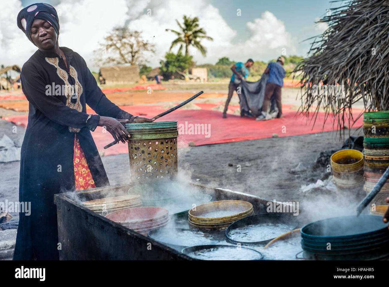 People prepare anchovies, locally called Dagaa, for drying at Mkokotoni ...