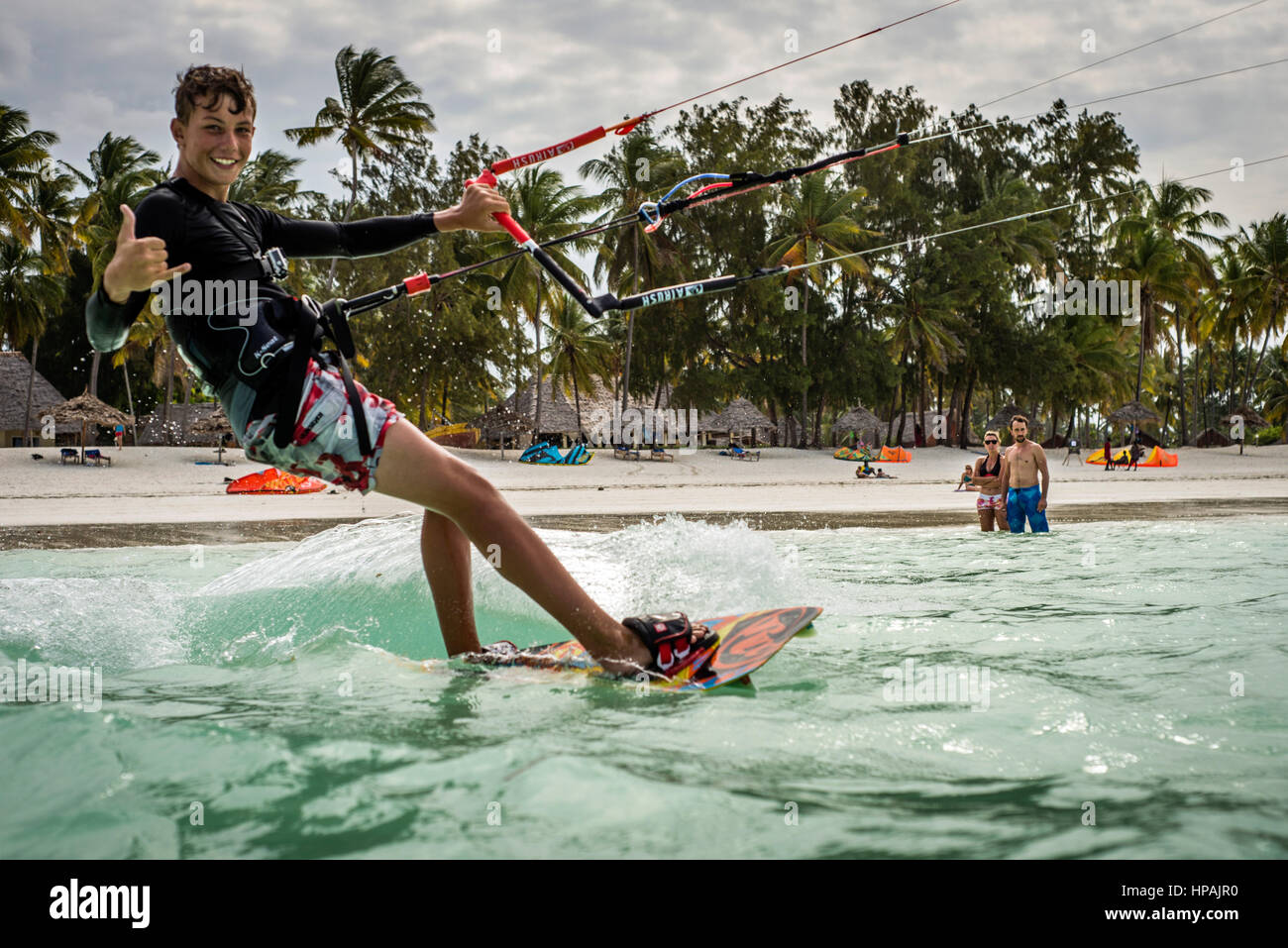 Kitesurfing on a beach of Paje, Zanzibar, Tanzania. Paje is a windy ...