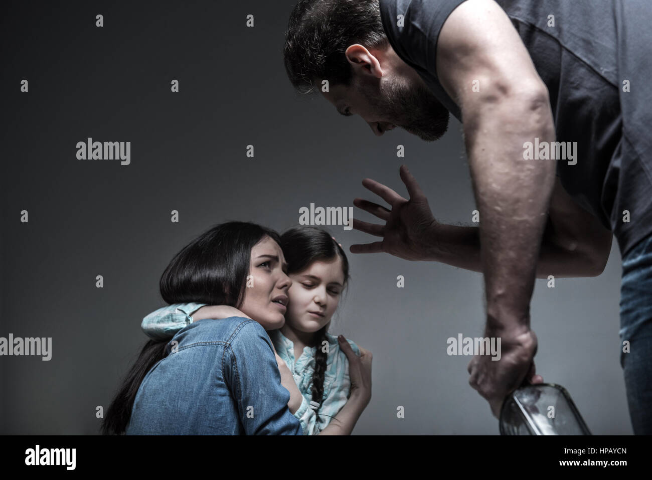 Be in danger. Angry bearded man with bottle in hand shouting at his ...