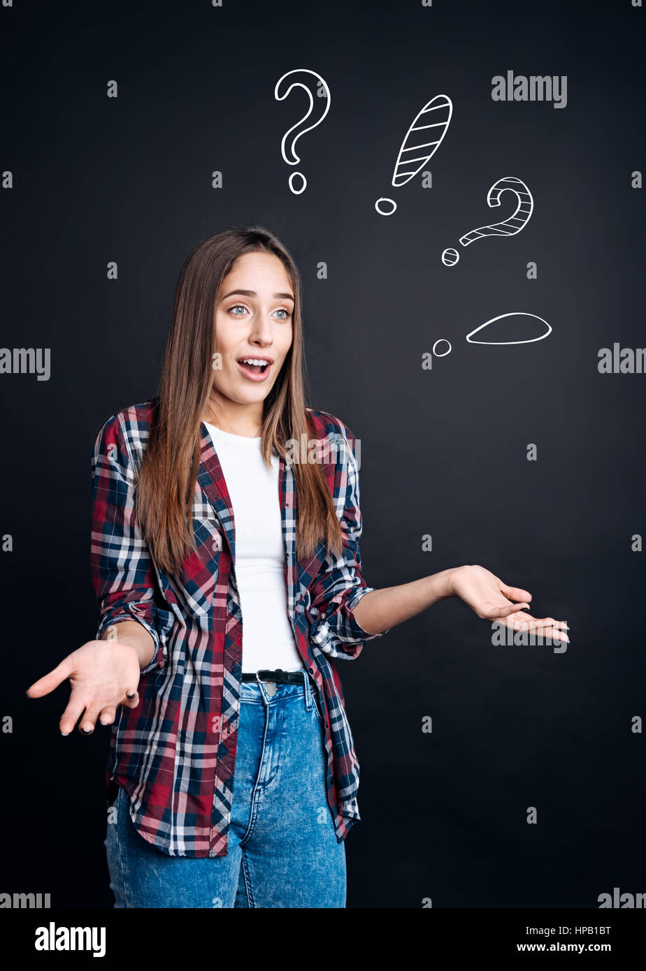 I have a question. Pleasant delighted surprised woman having some ...