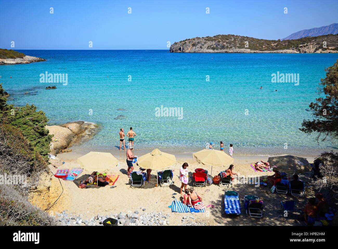 Tourists relaxing on the beach, Istro, Crete, Greece, Europe Stock ...