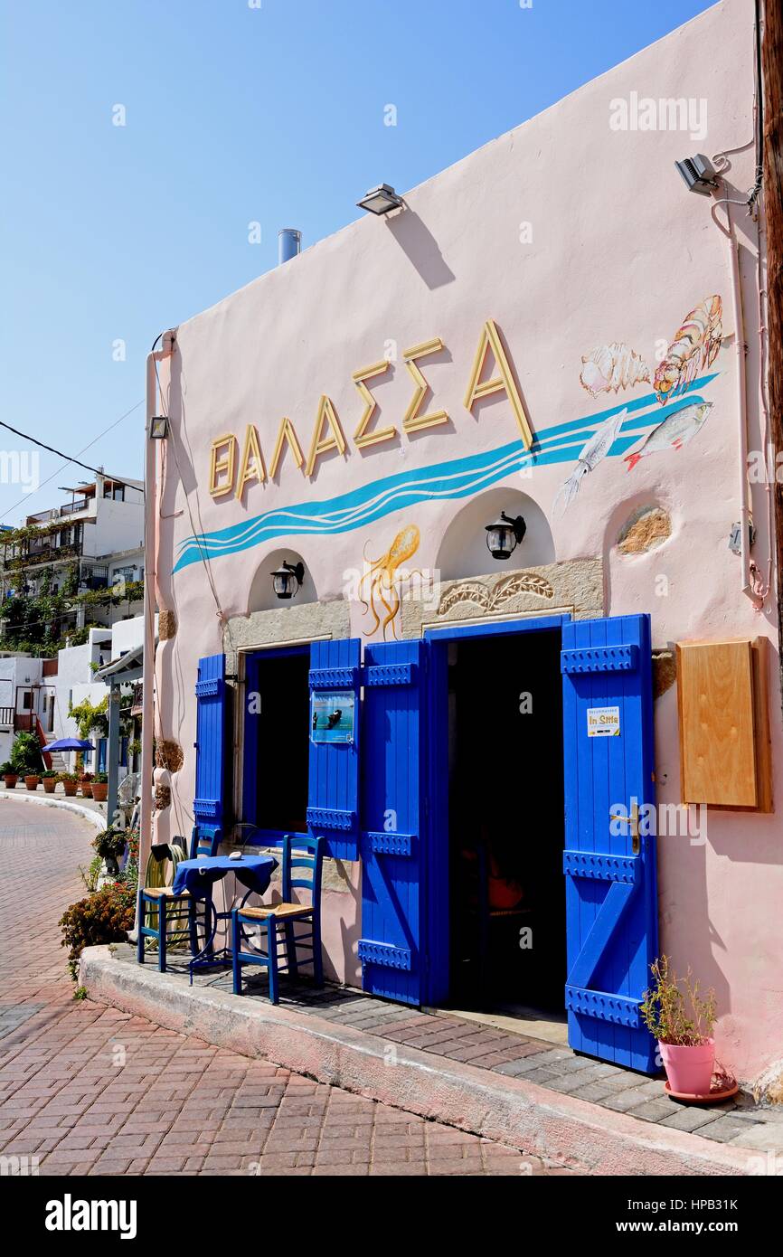 Traditional Greek taverna in the harbour area, Makrigialos, Crete ...