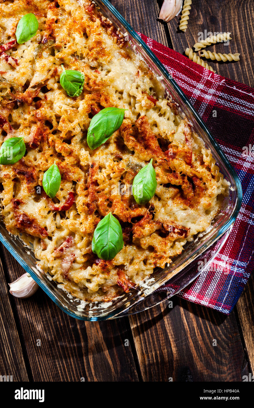 Casserole fusilli pasta with sausage, zucchini, paprika and cheese ...