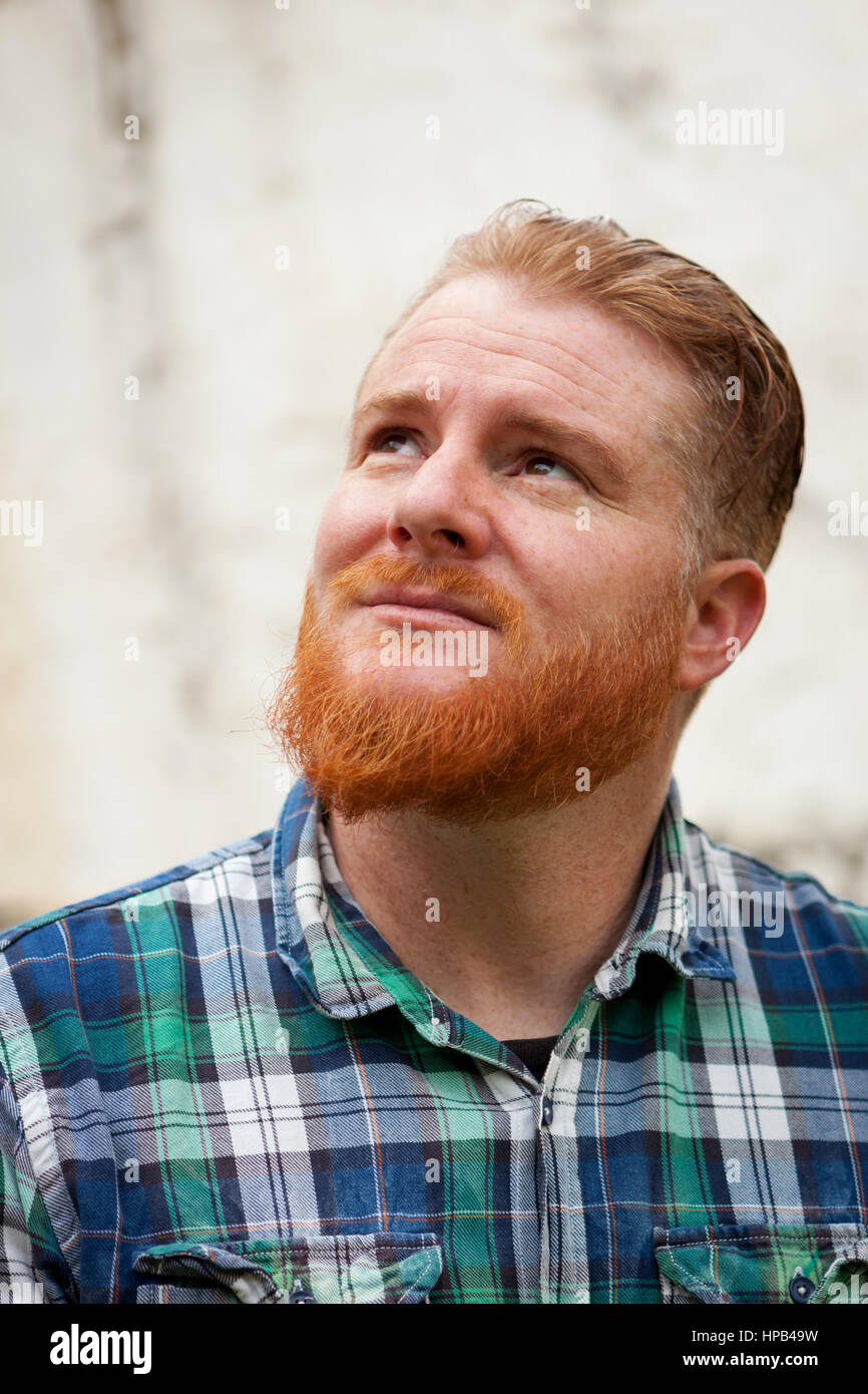 Portrait of red haired man with plaid shirt and long beard Stock Photo ...