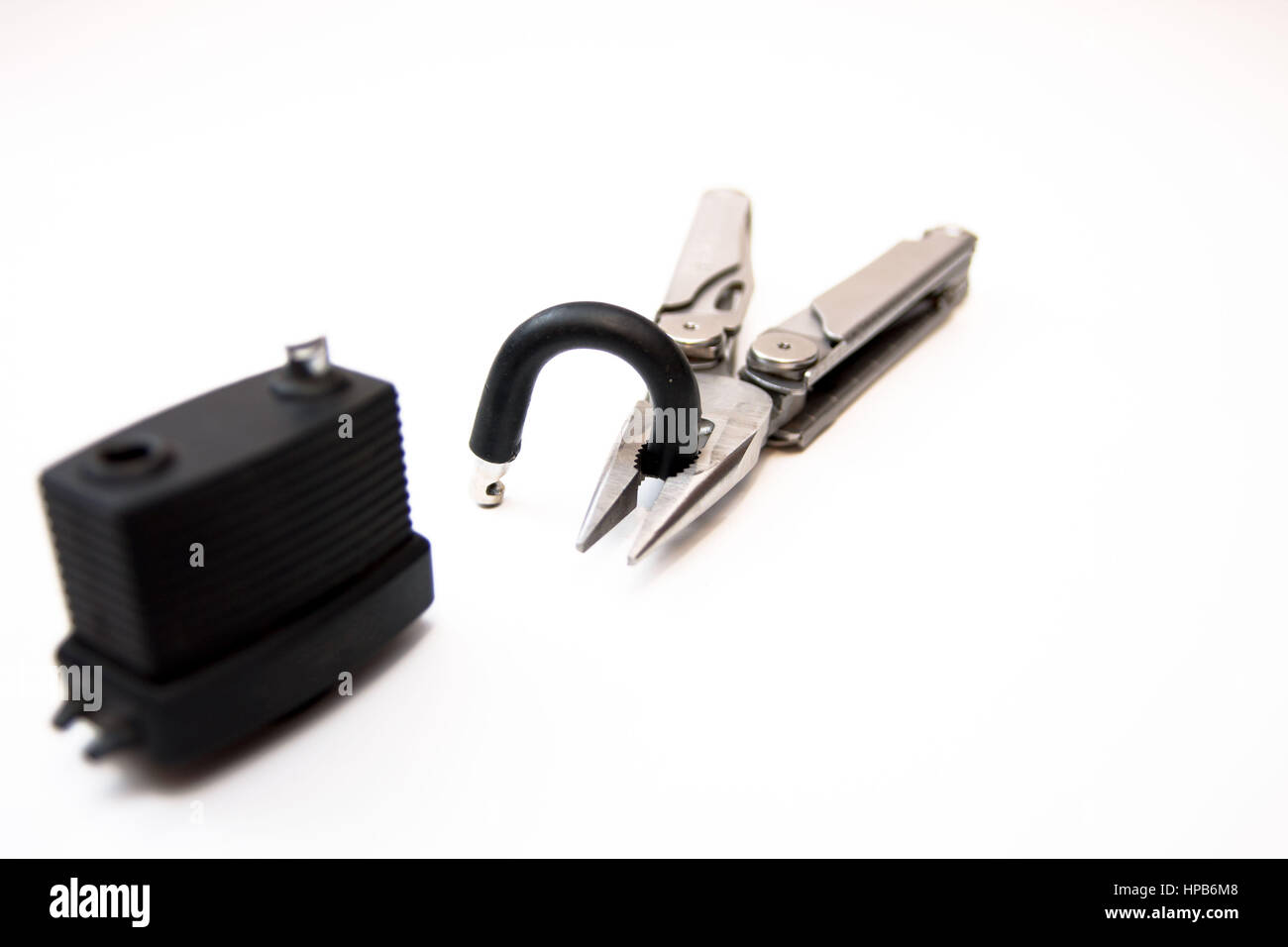 Broken lock on a white background. Lock broken cutters Stock Photo - Alamy