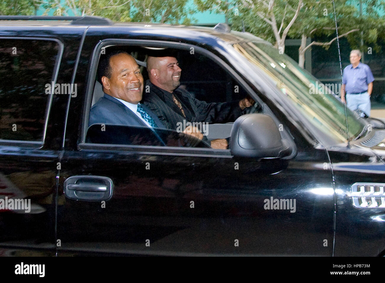 O.J. Simpson smiles while driving away from the Clark County Regional ...