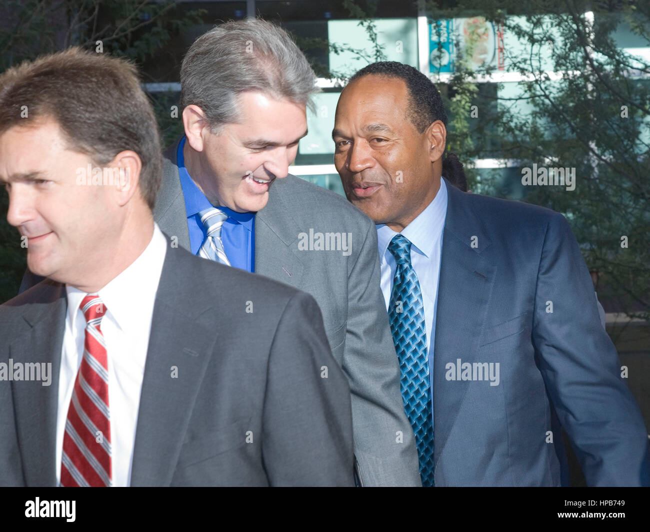 O.J. Simpson, right, arrives with his attorneys, Gabriel Grasso, center ...