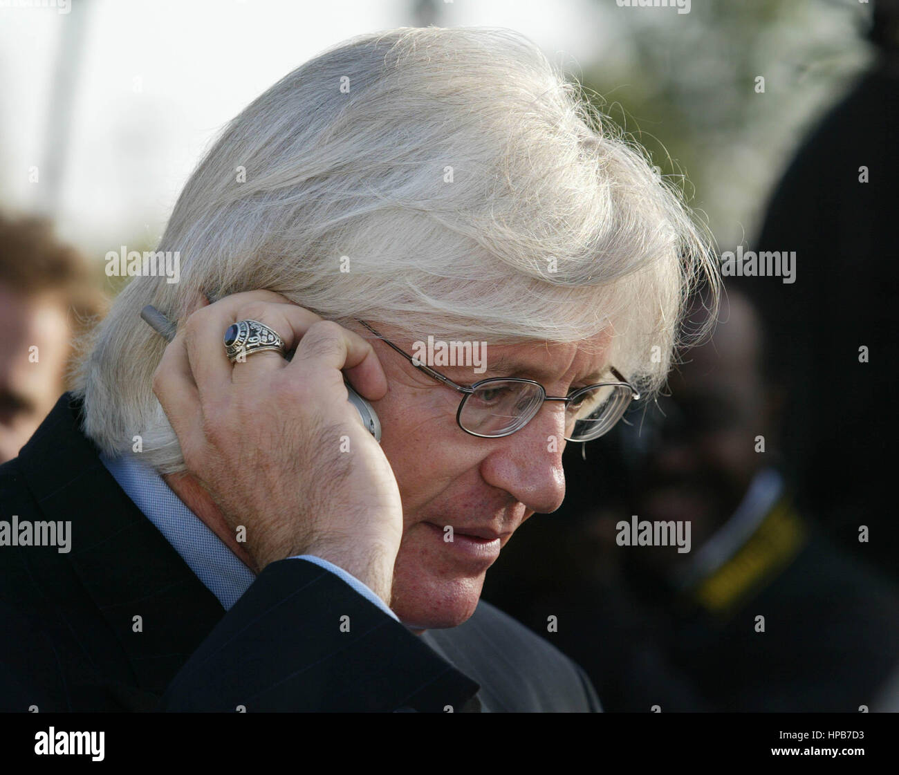 Michael Jackson 's attorney, Thomas A. Mesereau, Jr., talks on his cell ...