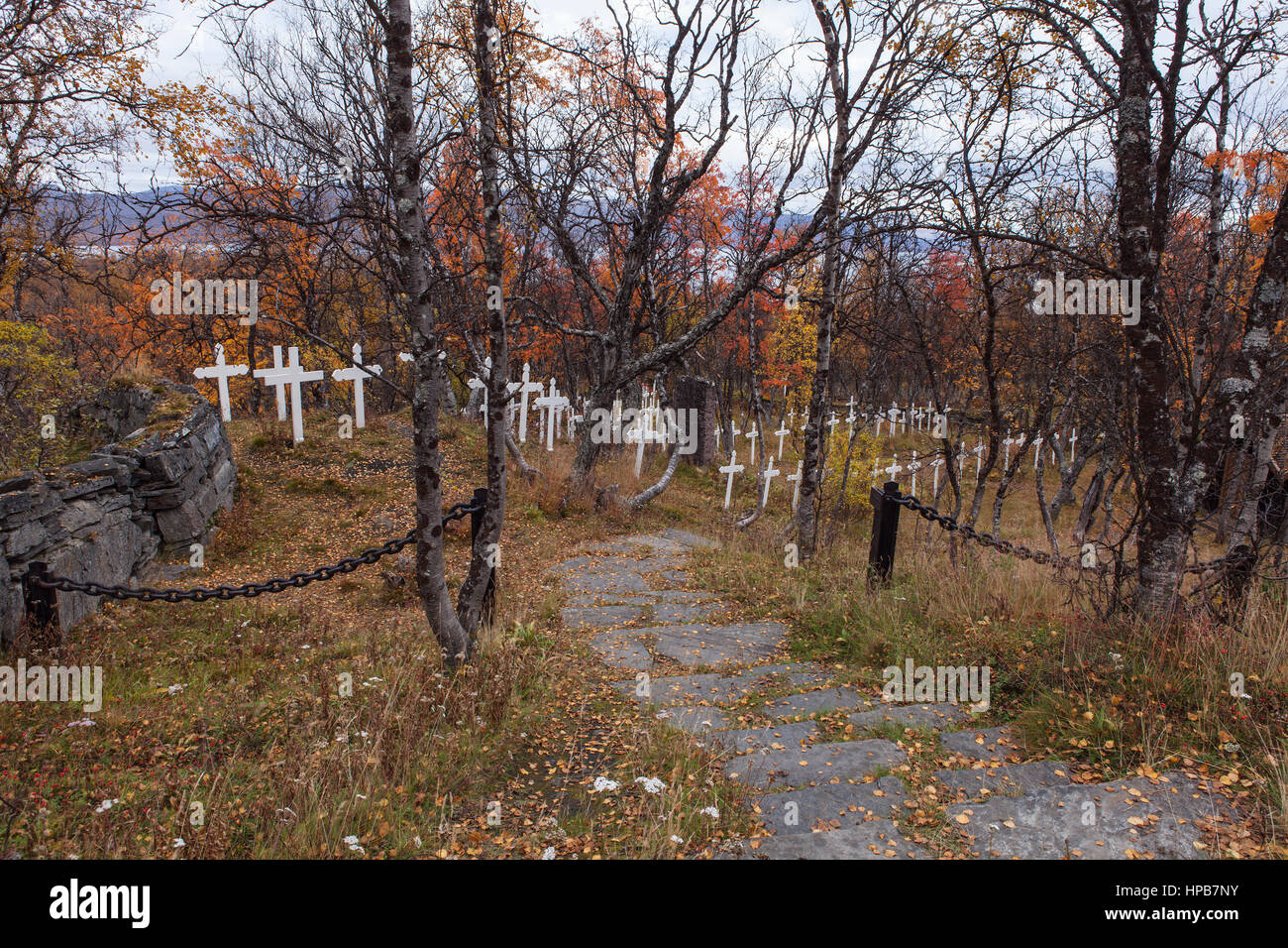 Colorful cemetery in autumn, fall. Gate, chains this side the white ...