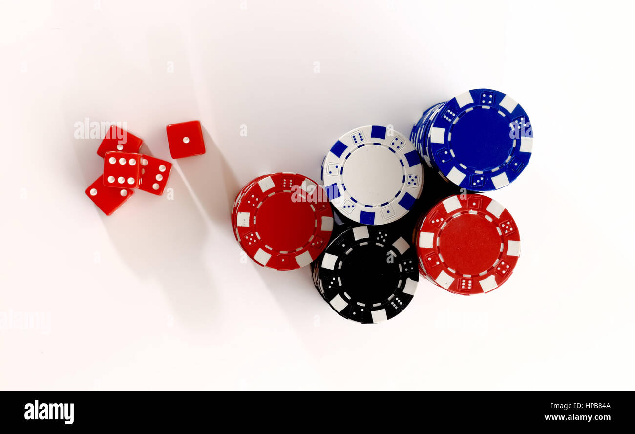 Red dice and casino chips from above. Dice and color chips over white ...