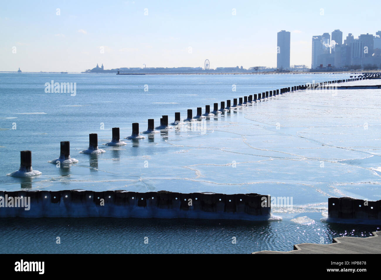 Wave breaking posts line up to lead to a cold, wintery view of the ...