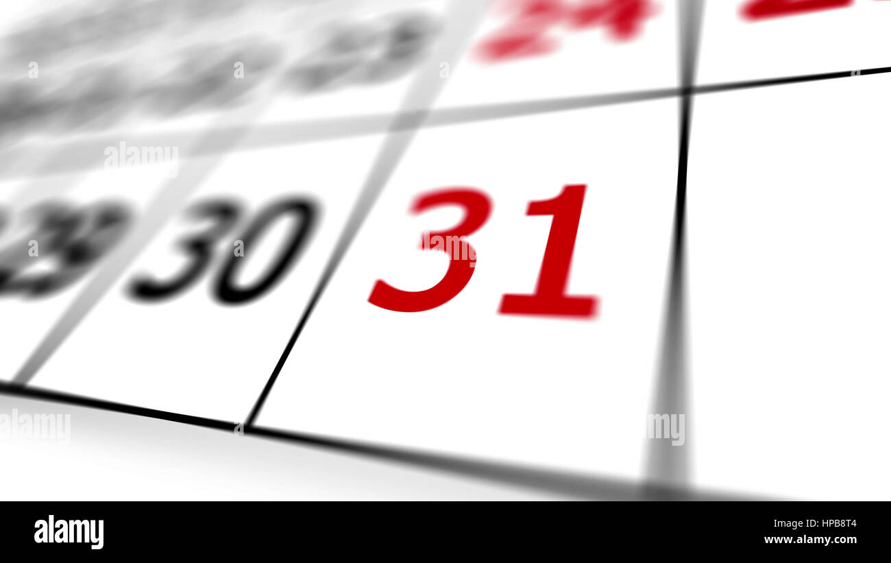 Calendar page with marked red date of 31st. Shallow depth of field ...