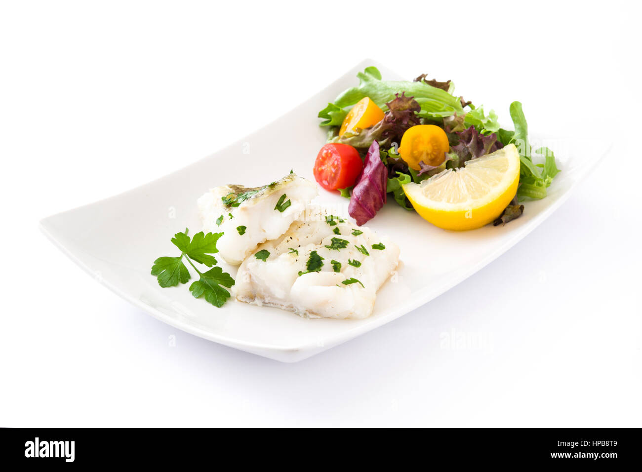 Fried cod fillet and salad in plate isolated on white background Stock ...
