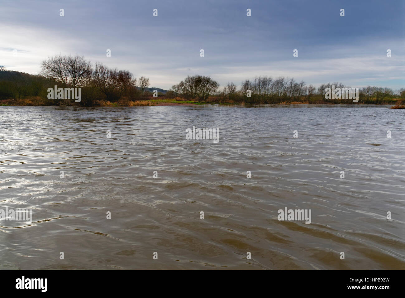 Dark river water dark grey clouds hi-res stock photography and images ...